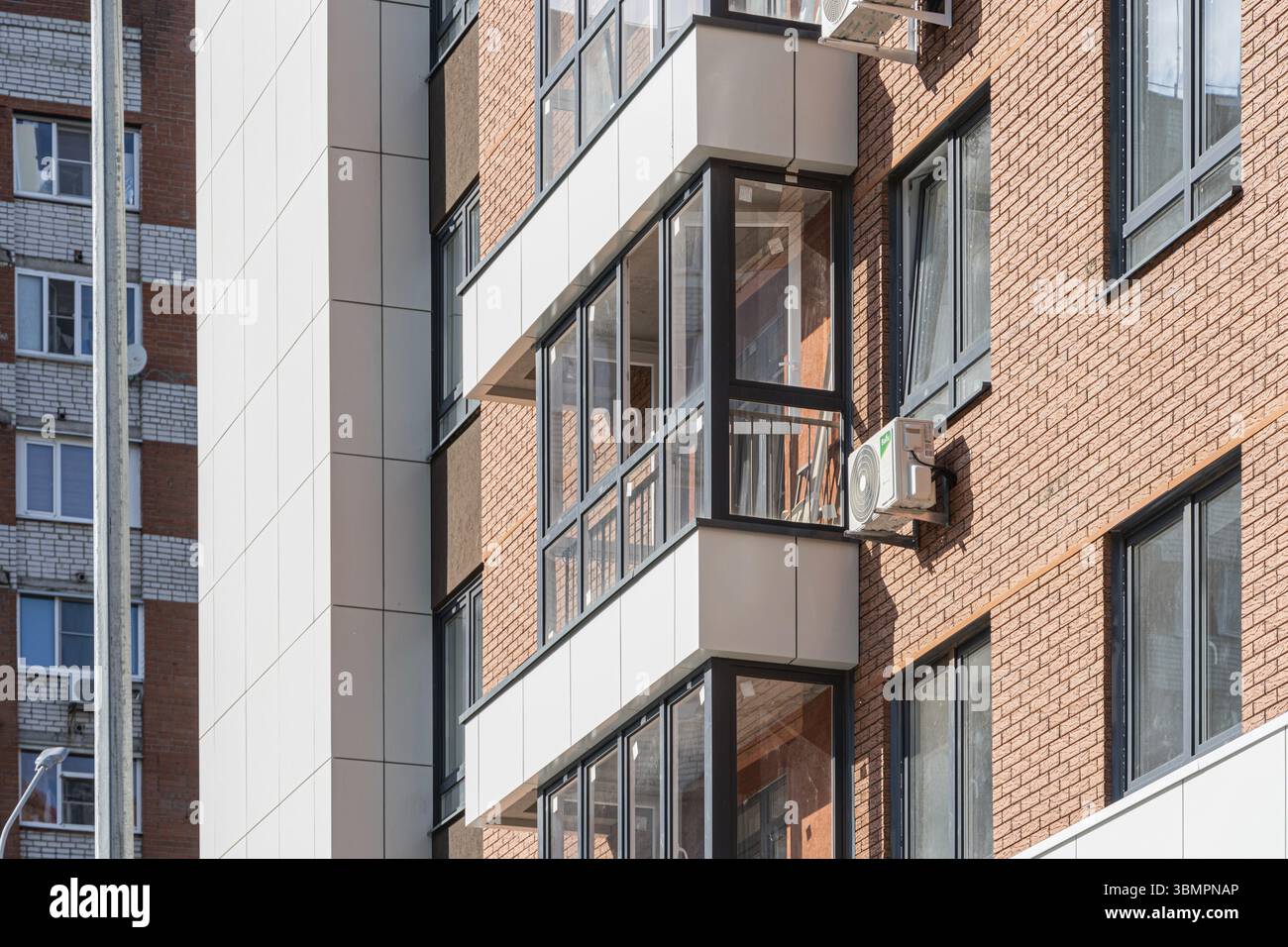 New building facade in housing complex. Modern style in architecture ...