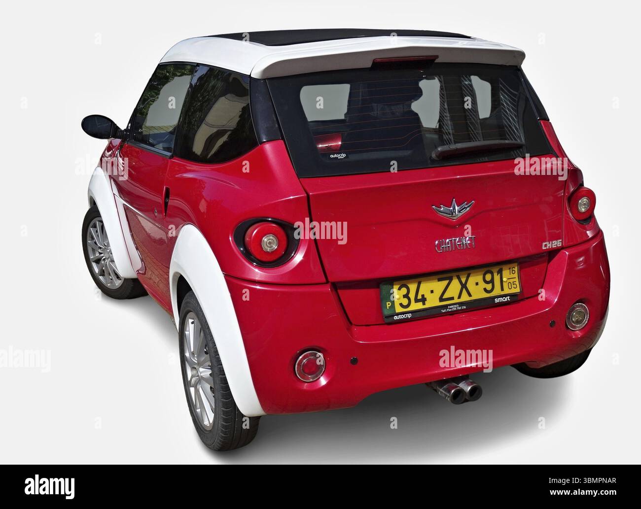 Red and white Chatenet CH26 microcar parked on white background, rear ...