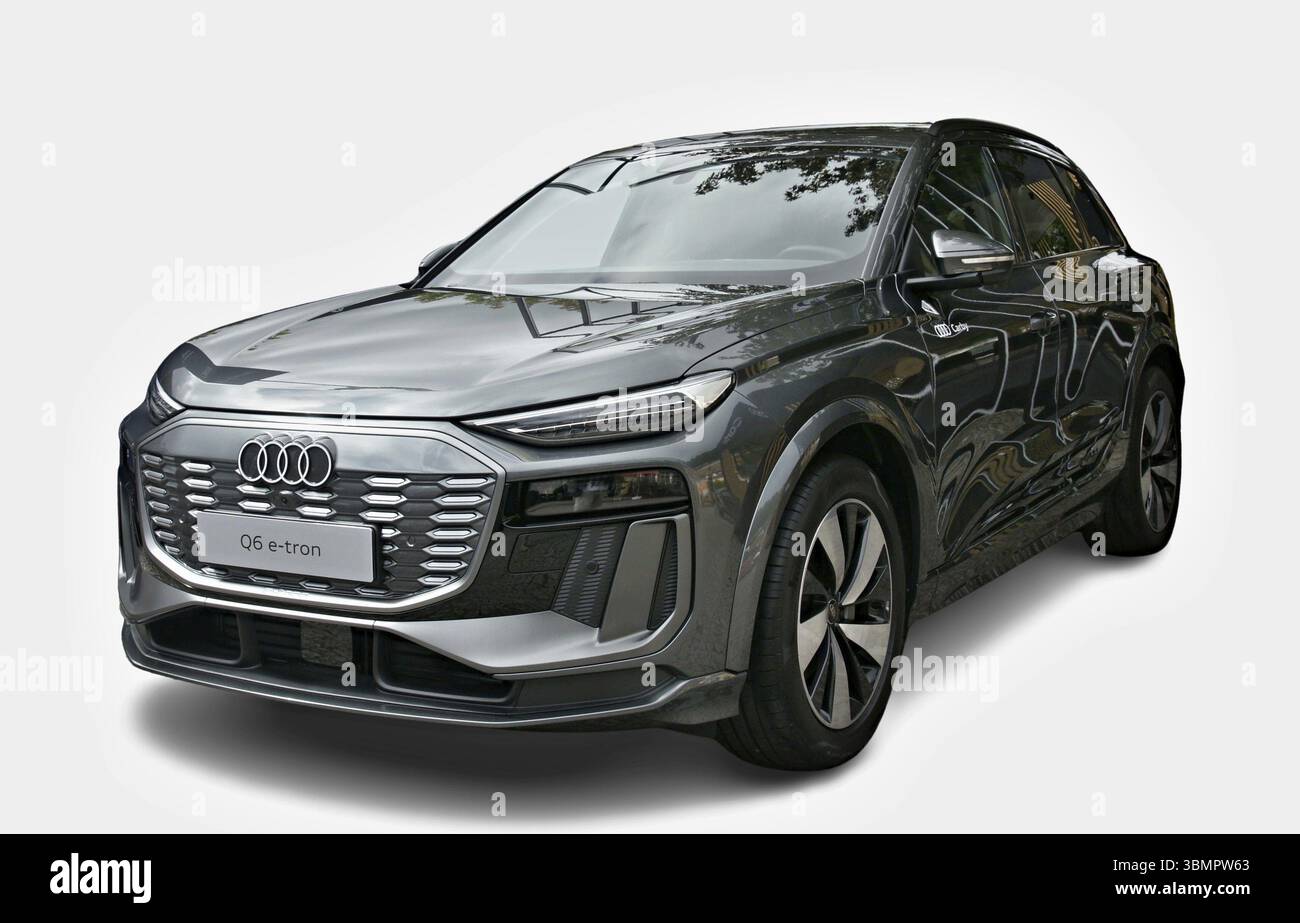 Stylish gray Audi Q6 e-tron electric SUV parked, showcasing its sleek ...