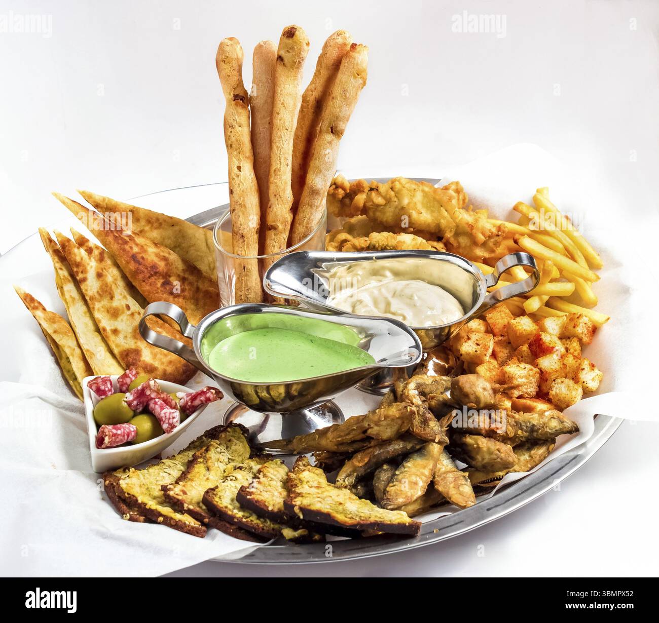 Large plate with a wide selection of snacks for beer served with two ...