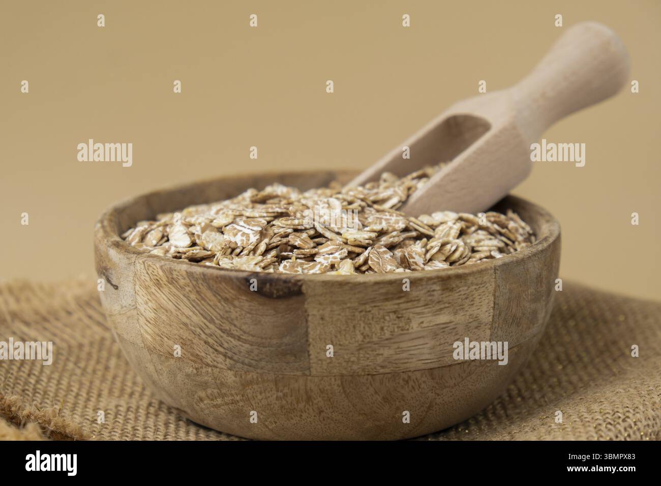 Raw oatmeal porridge in neutral beige background copy space. Whole ...