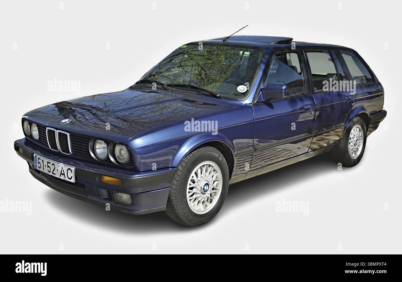 Classic BMW E30 touring car parked in the sun with sunroof open ...