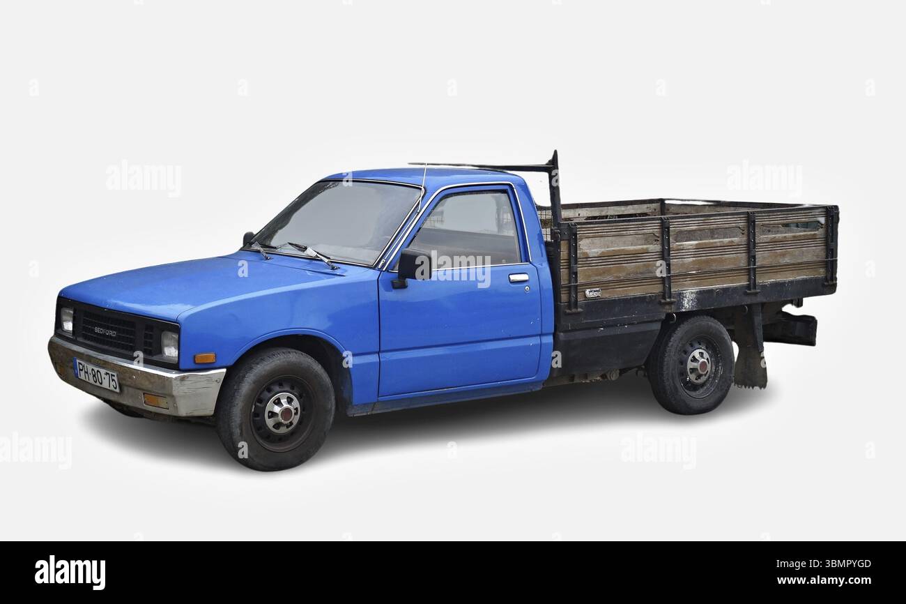 Classic blue Isuzu pickup truck featuring a weathered wooden cargo bed ...