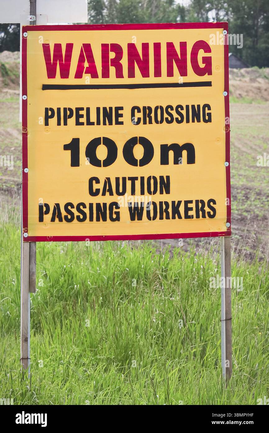 Warning Pipeline Crossing Caution sign Stock Photo - Alamy