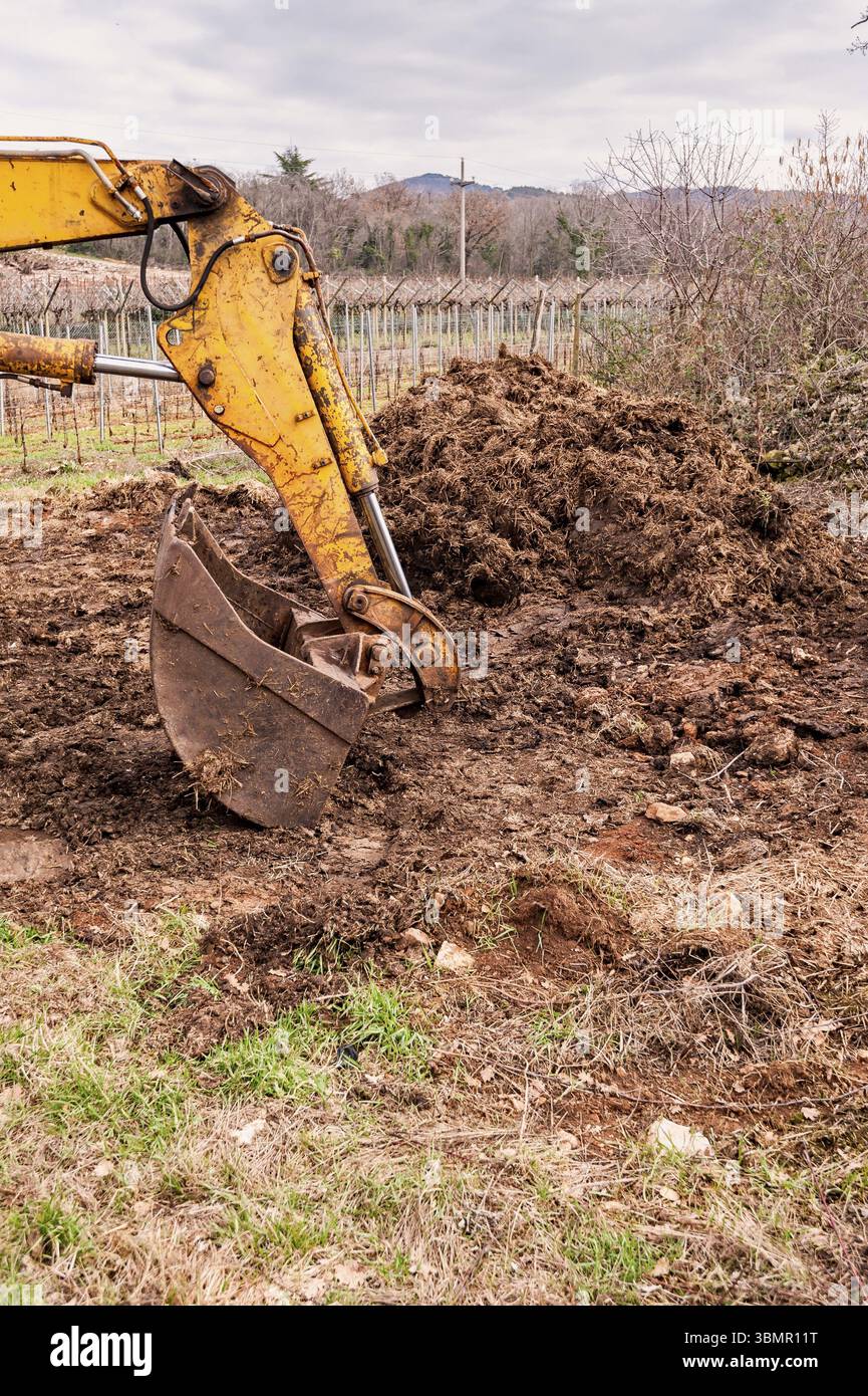 Old digger used to move and load manure in agriculture Stock Photo - Alamy