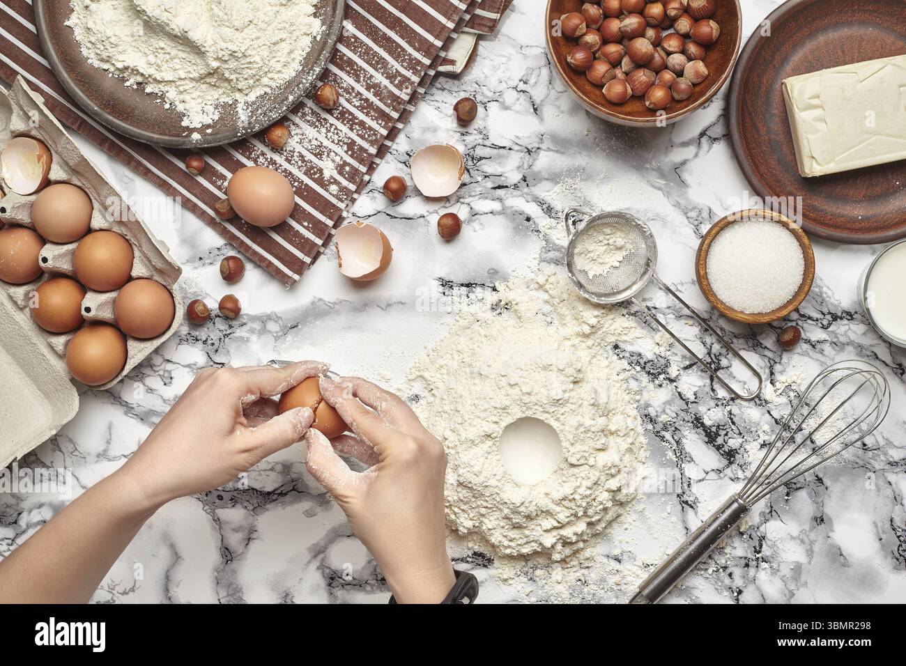 Close-up shot. Top view of a baker cook place, working with a raw dough ...