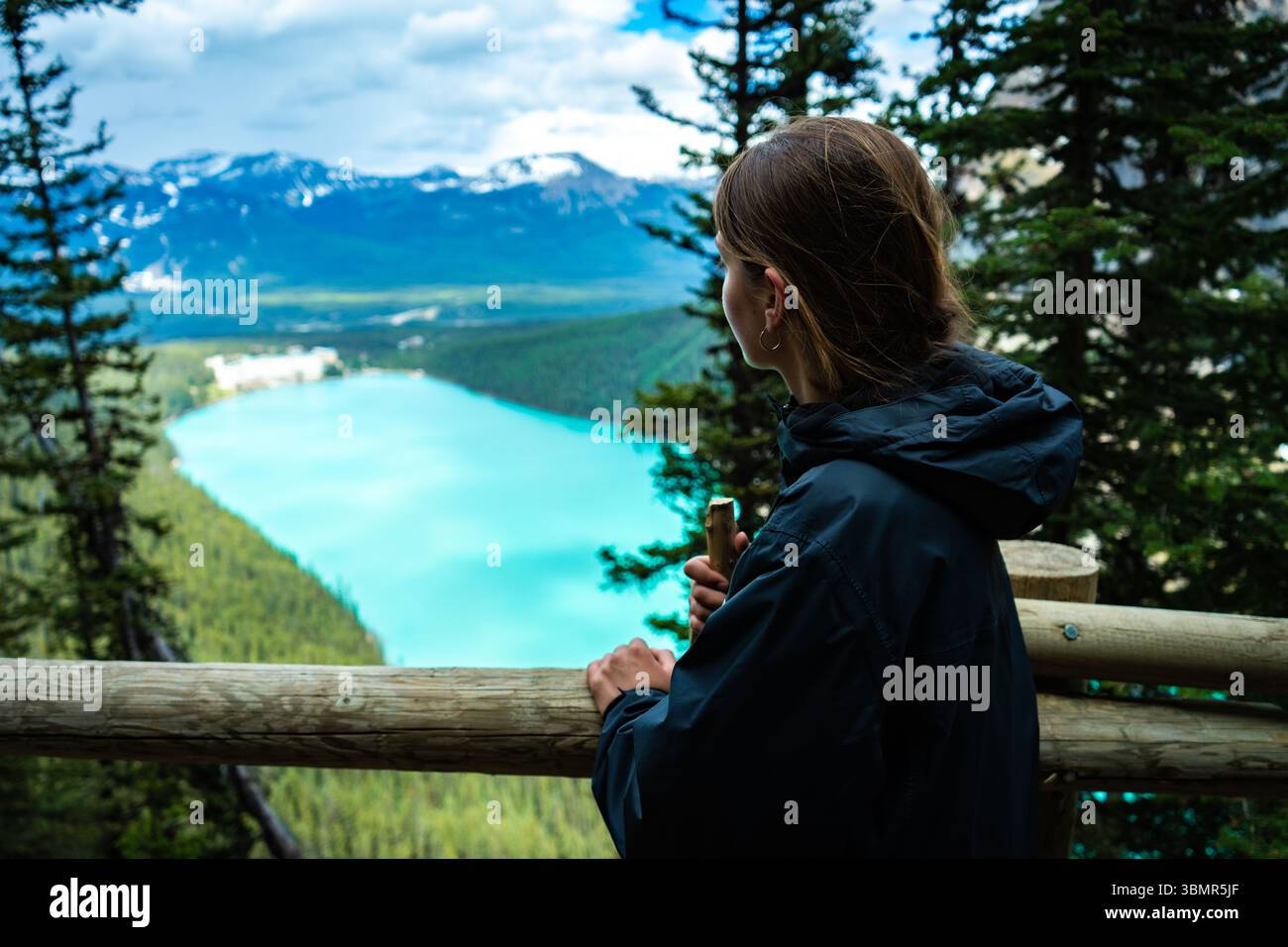 Woman gazing turquoise lake hi-res stock photography and images - Alamy