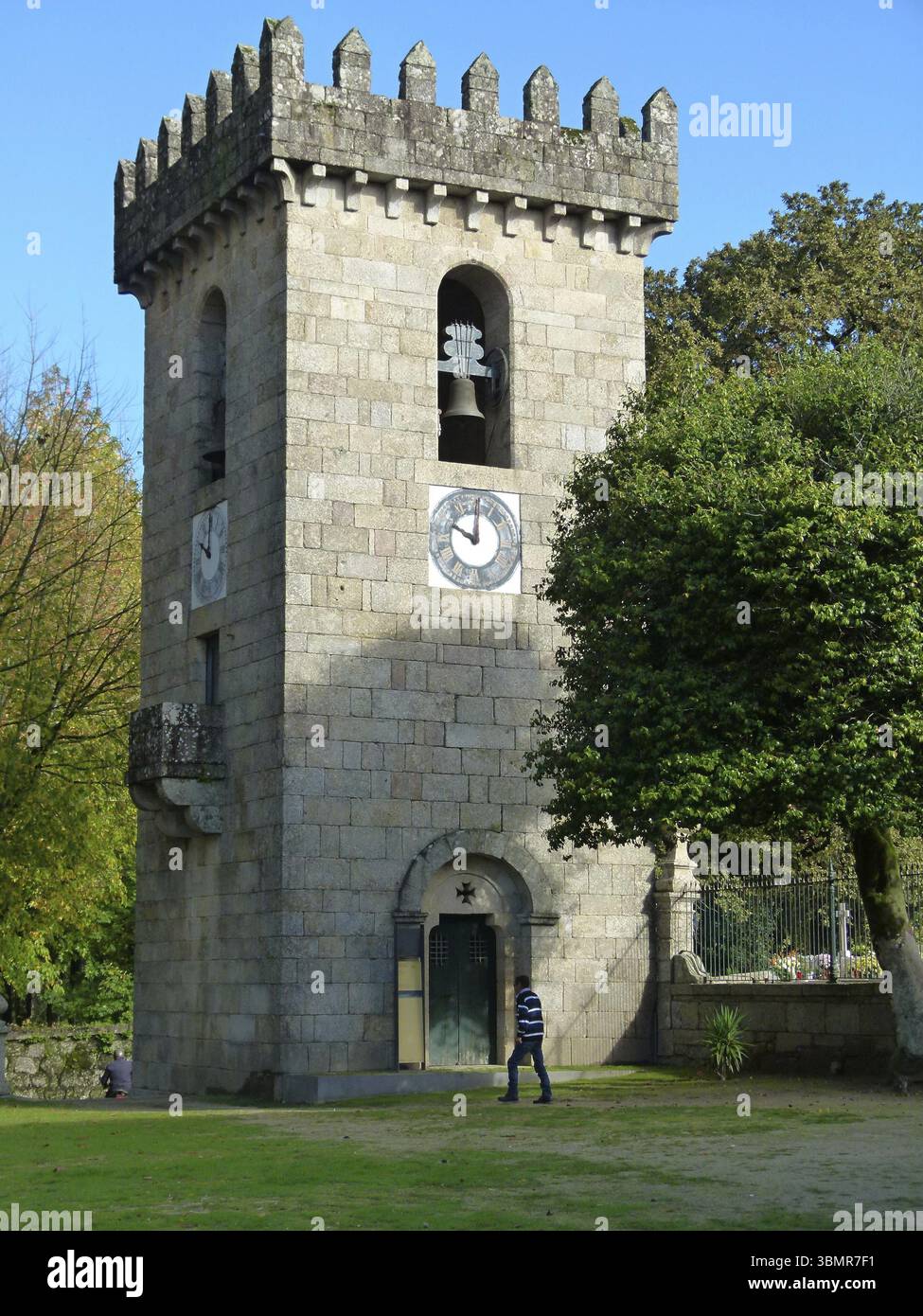 Ancient stone bell tower with clock and bell, located in Barcelos ...