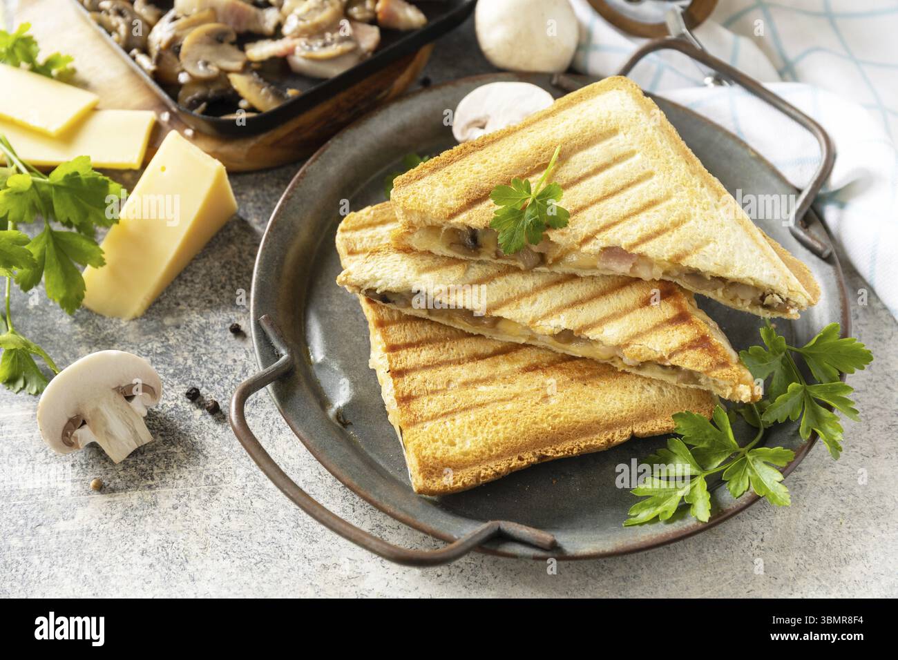 Delicious club sandwich, homemade grilled cheese, bacon and mushroom ...