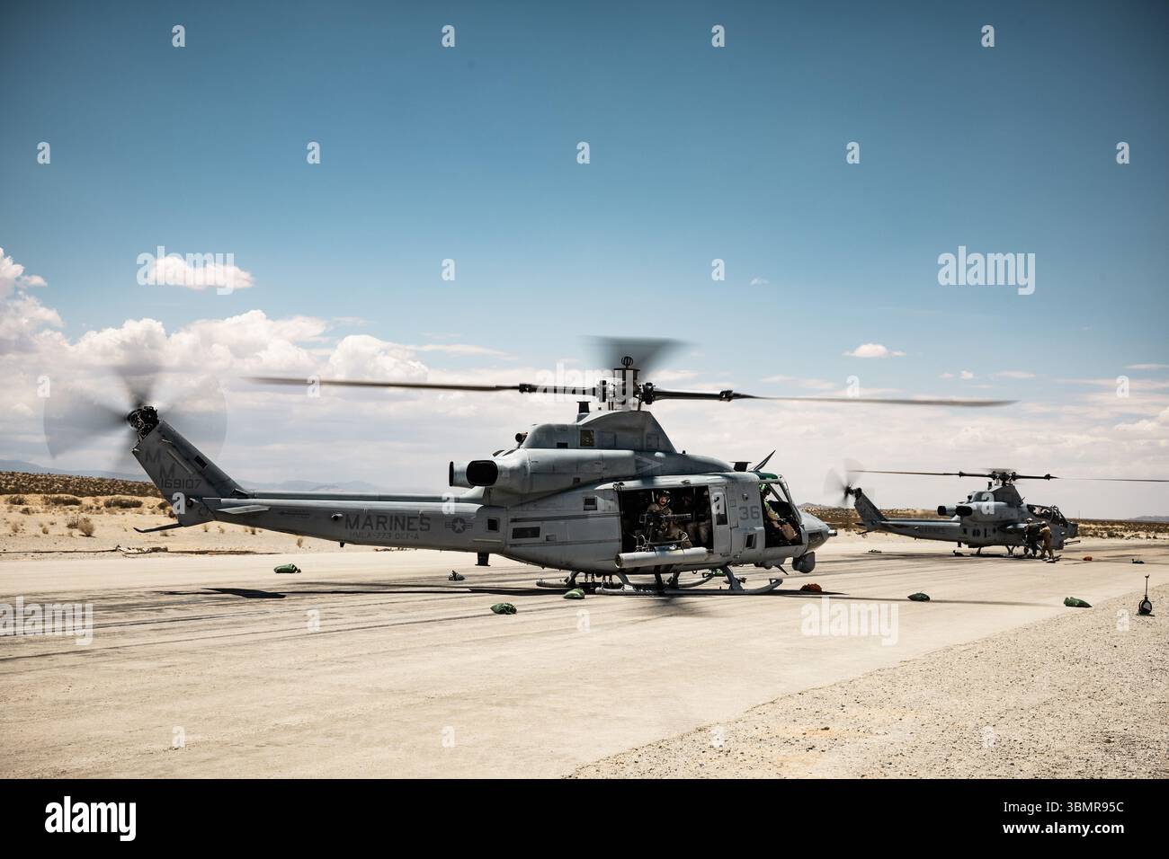 A U.S. Marine Corps UH-1Y Huey helicopter, left, and an AH-1Z Cobra ...