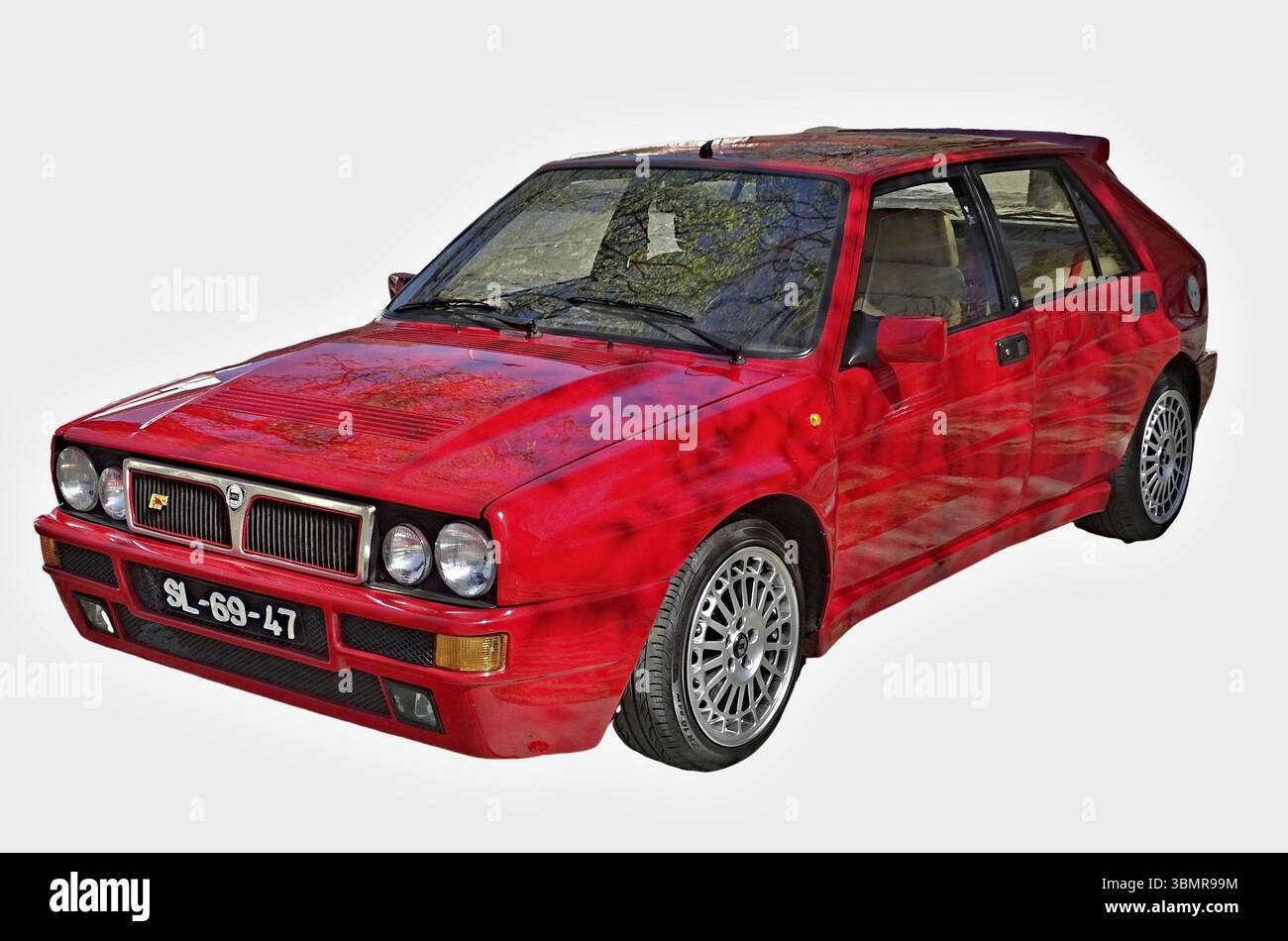 Classic red Lancia Delta Integrale Evo parked, showing its iconic ...