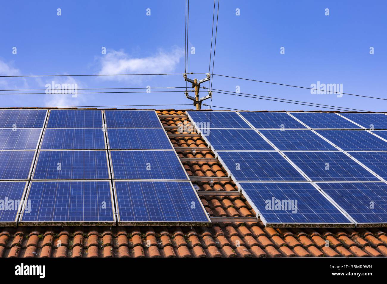 Solar panels of a photovoltaic system on a private house roof with ...
