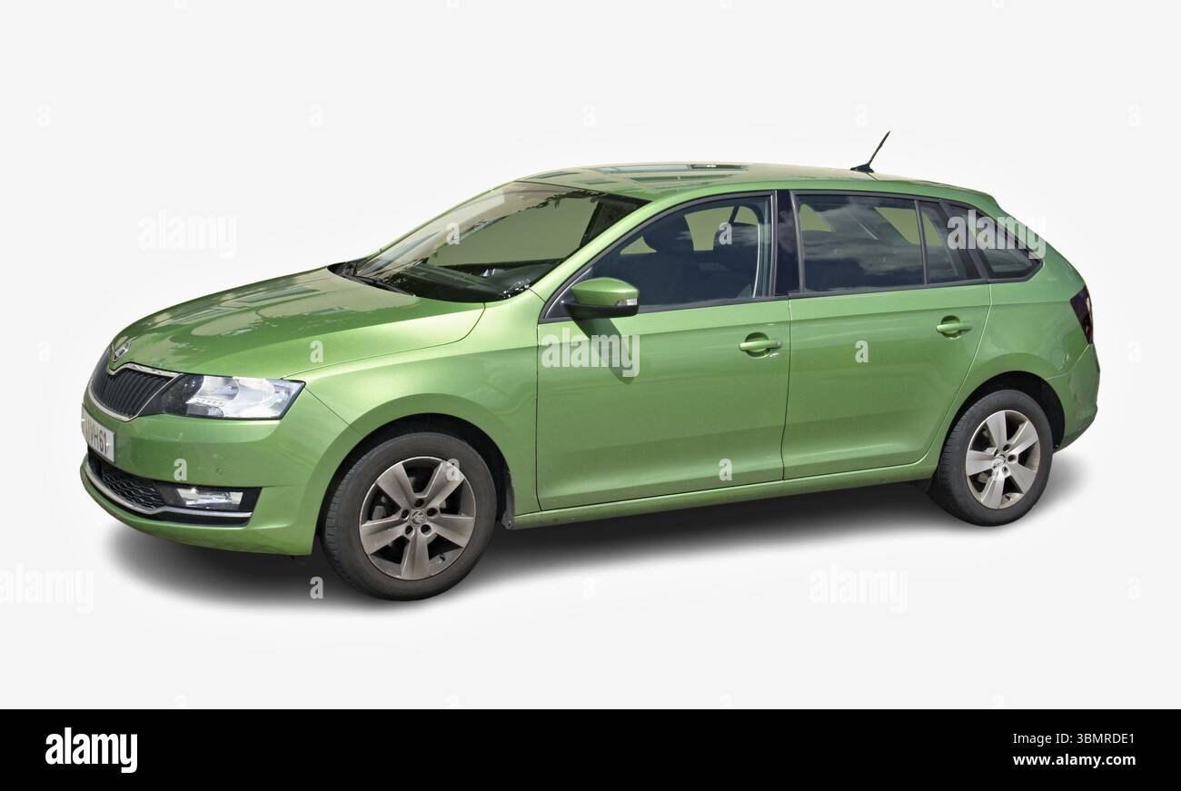 Shiny metallic green skoda Rapid Spaceback family car parked on white ...