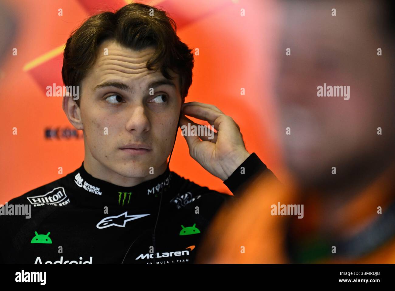 McLaren driver Oscar Piastri of Australia stands in the pit the third ...