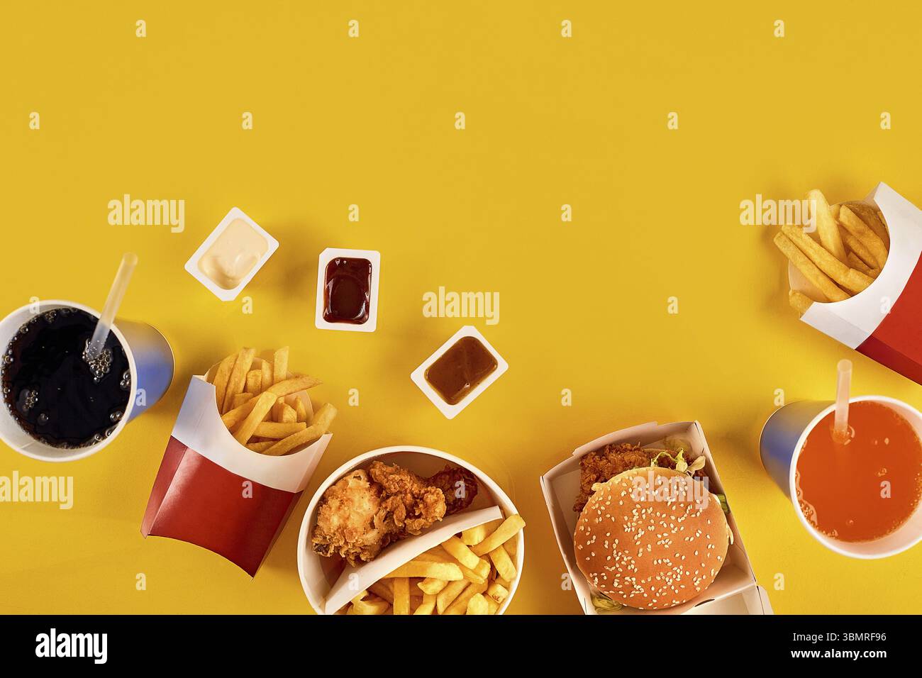 Fast food concept with greasy fried restaurant take out as onion rings ...