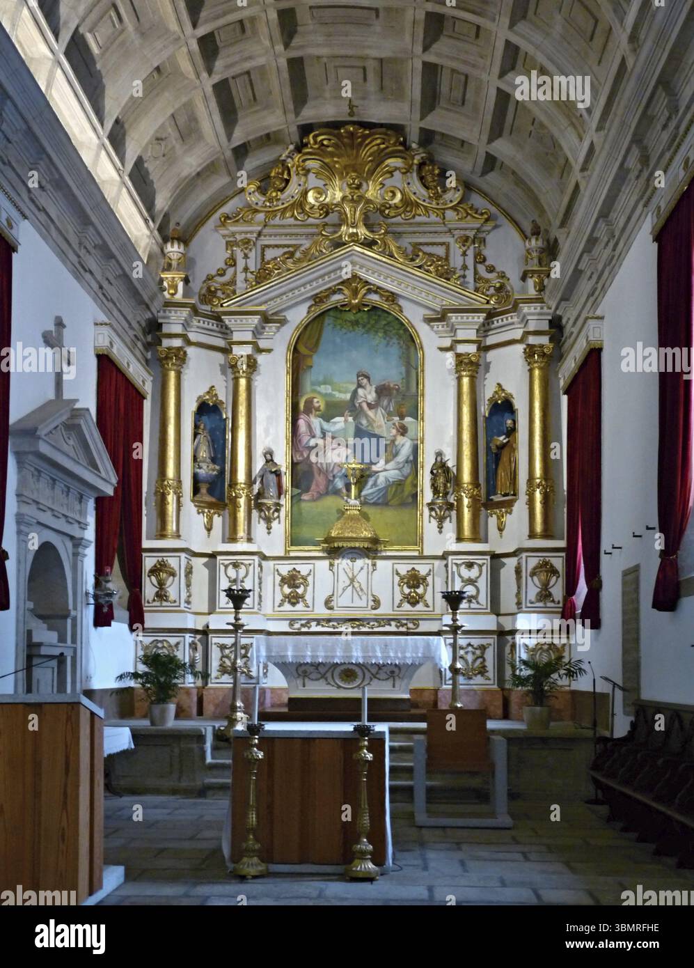 Golden altar with painting of jesus christ inside a catholic church ...