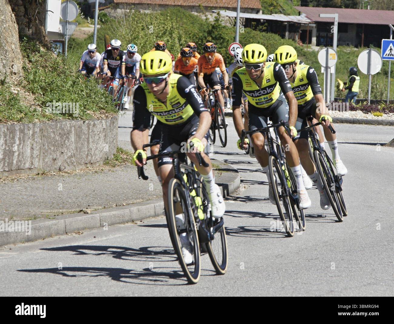 Group of professional cyclists riding their road bikes during a cycling ...