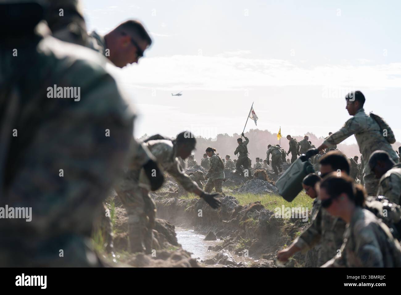 A U.S. Soldiers assigned to 3rd Infantry Division, run through a trench ...