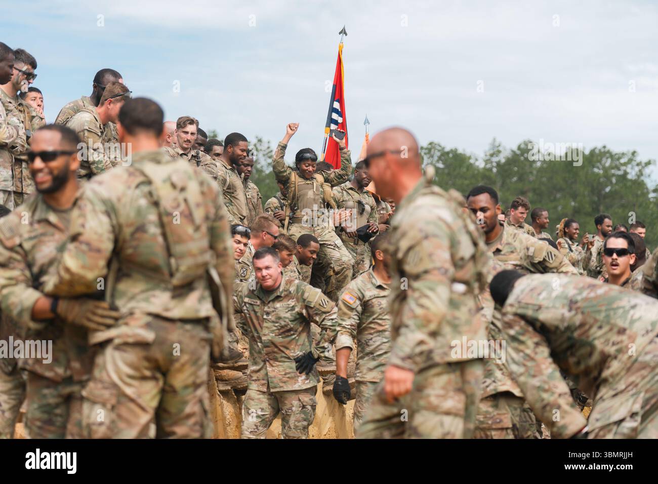 U.S. Soldiers assigned to 3rd Infantry Division, cheer on Soldiers ...