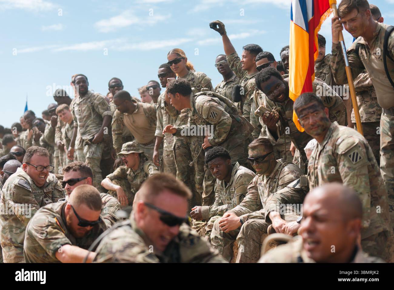 U.S. Soldiers assigned to 3rd Infantry Division, cheer on Soldiers ...