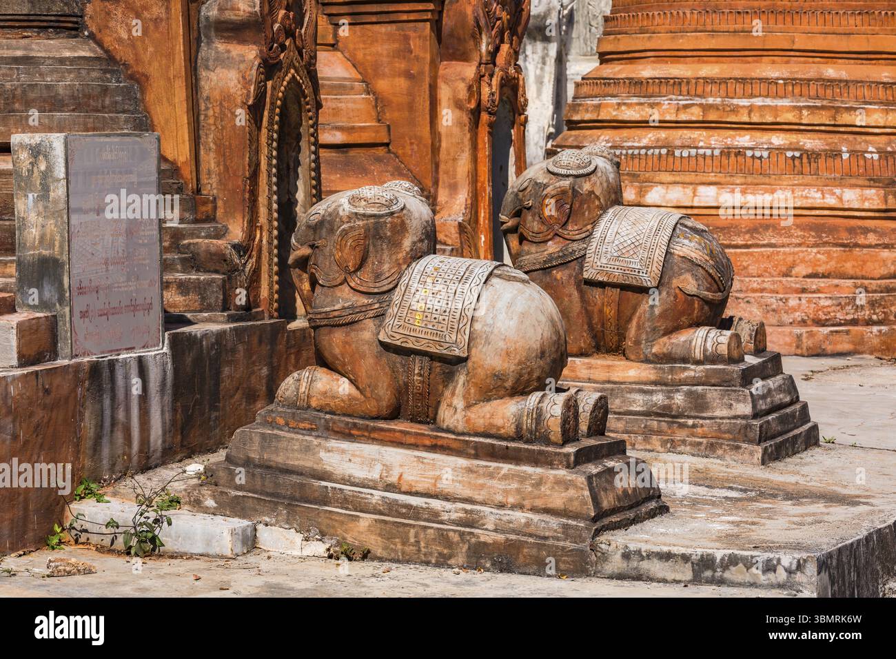 Two kneeling elephant sculptures as grave stupa at Burmese cemetery and ...