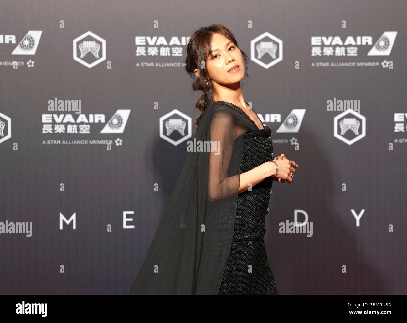 Singapore singer Tanya Chua poses for photographs as she arrives for the 36th Golden Melody ...