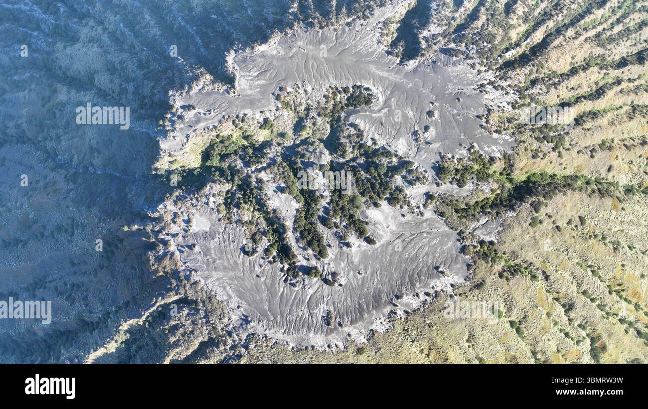 Batok volcano bird eye view reveals a striking pattern of ash and green ...