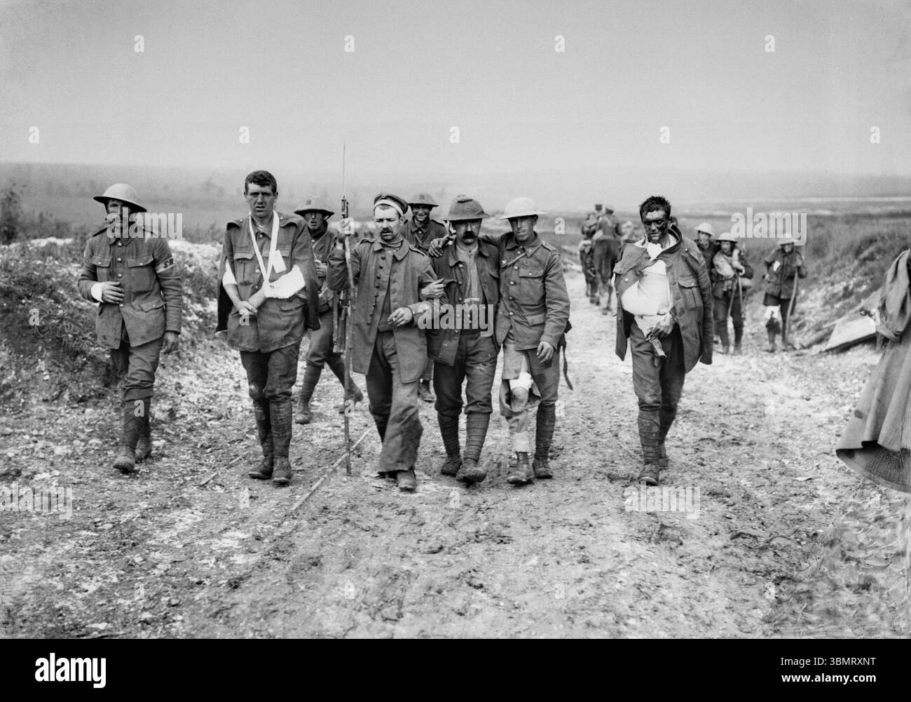 THE SOMME, FRANCE - 19 July 1916 - A German prisoner helps British ...