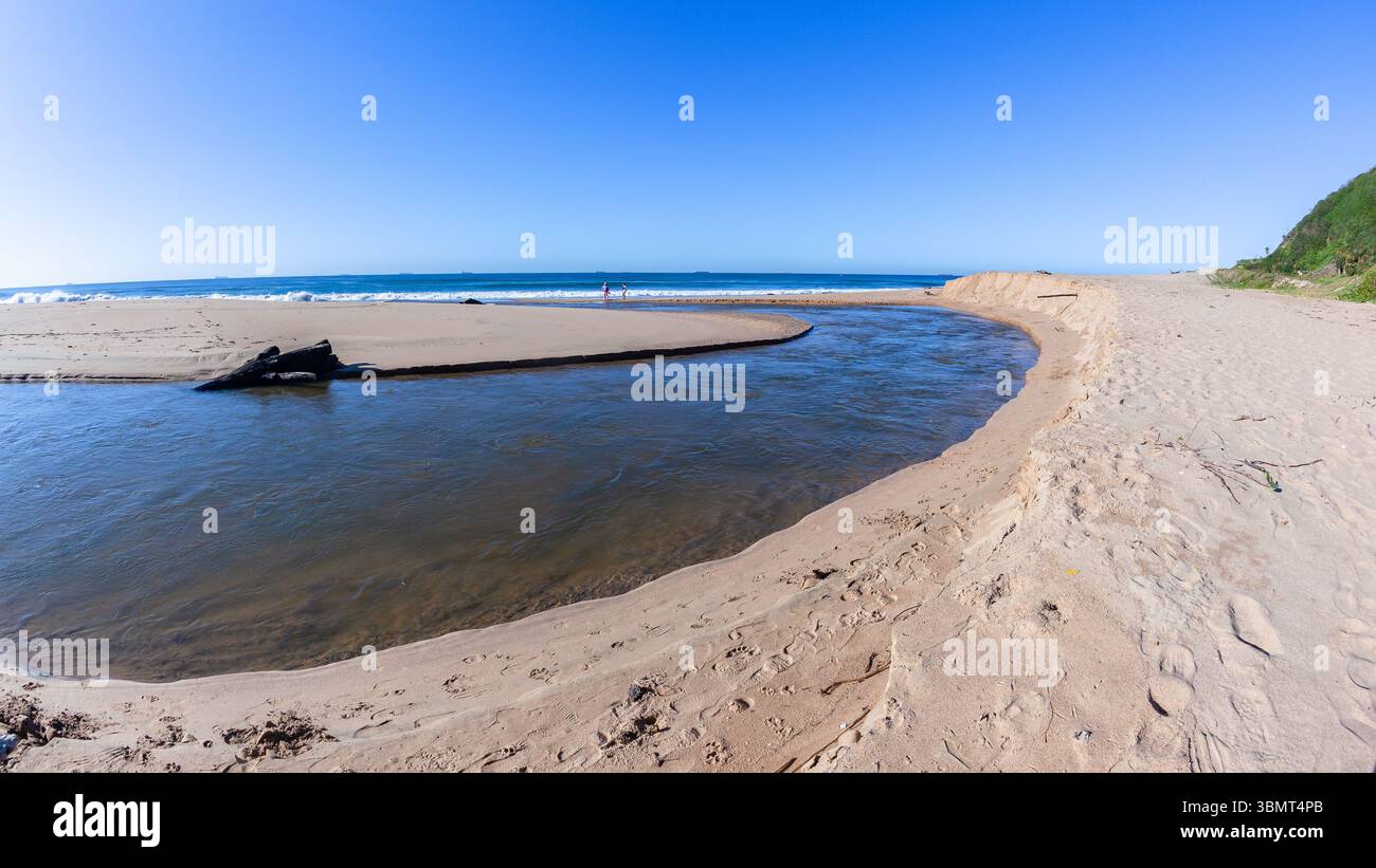 Beach open river mouth flowing waters towards sea blue ocean horizon ...