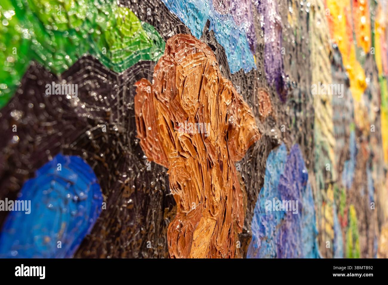 A close-up view of a vibrant and expressive painting created with the ...