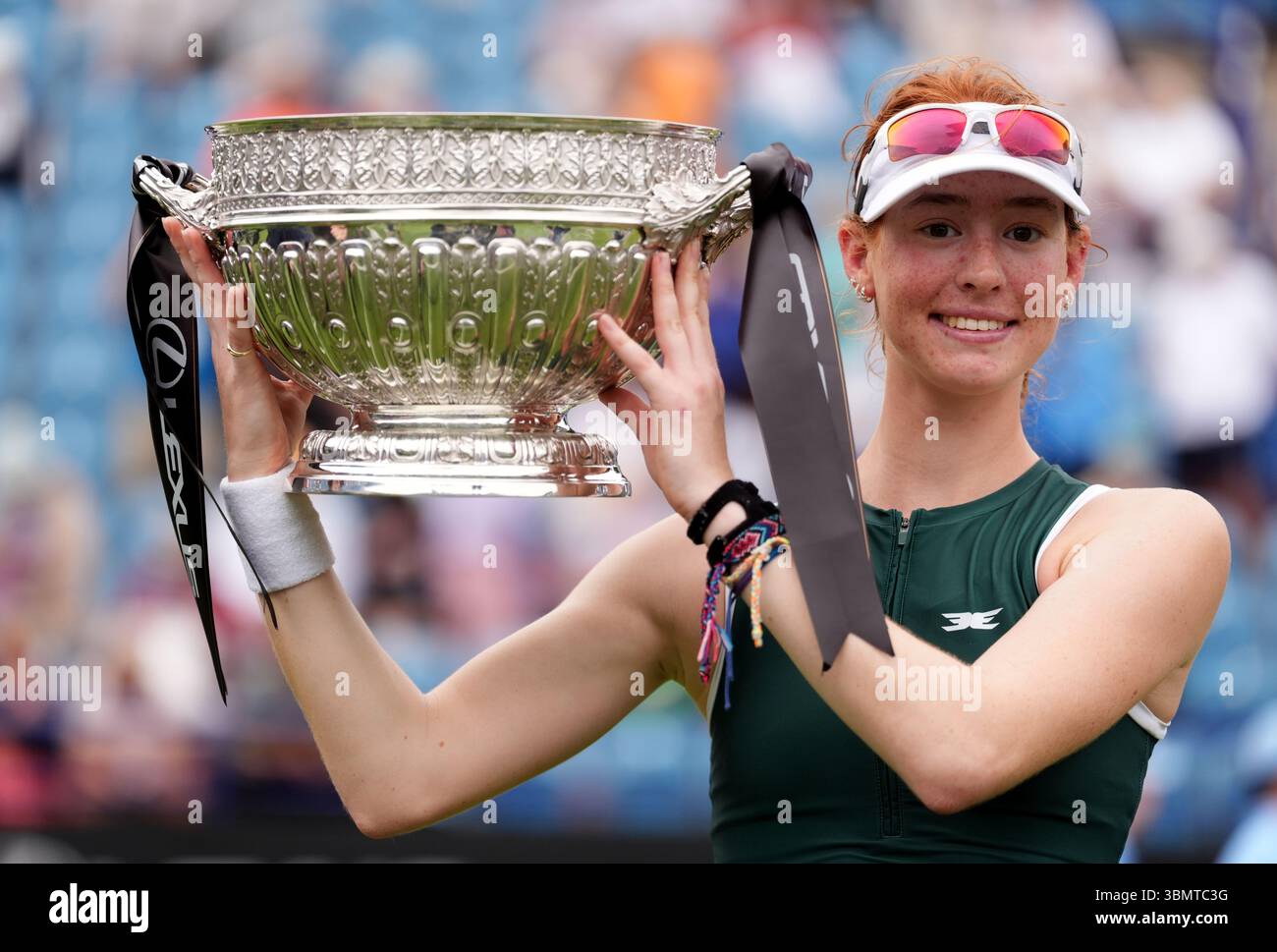 Maya Joint celebrates with the trophy after winning the Women's singles ...