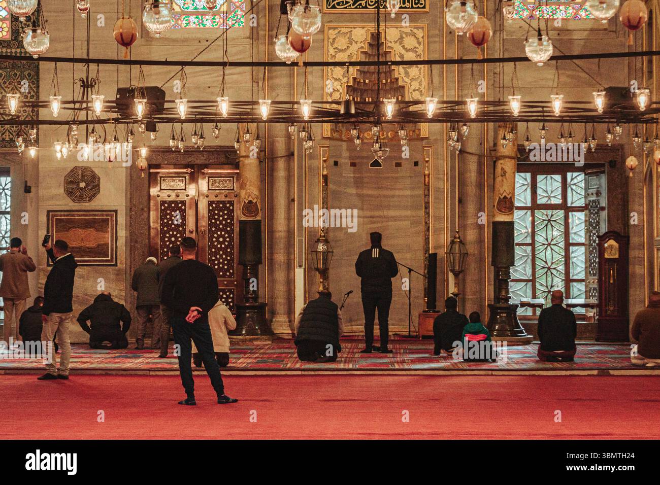 People praying in Blue Mosque Stock Photo - Alamy