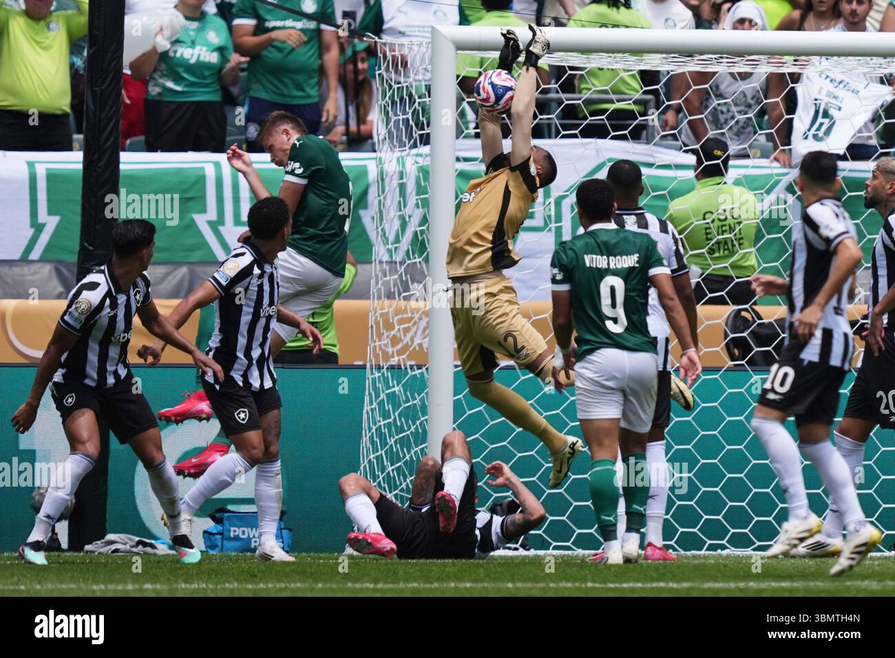 Botafogo goalkeeper John (12) reaches for the ball over Palmeiras ...