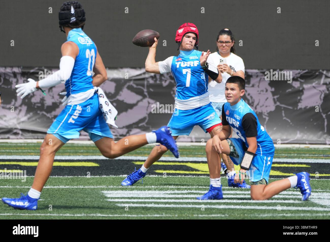 Tucson Turf quarterback Kainan Manna (7) stands back to pass during an ...