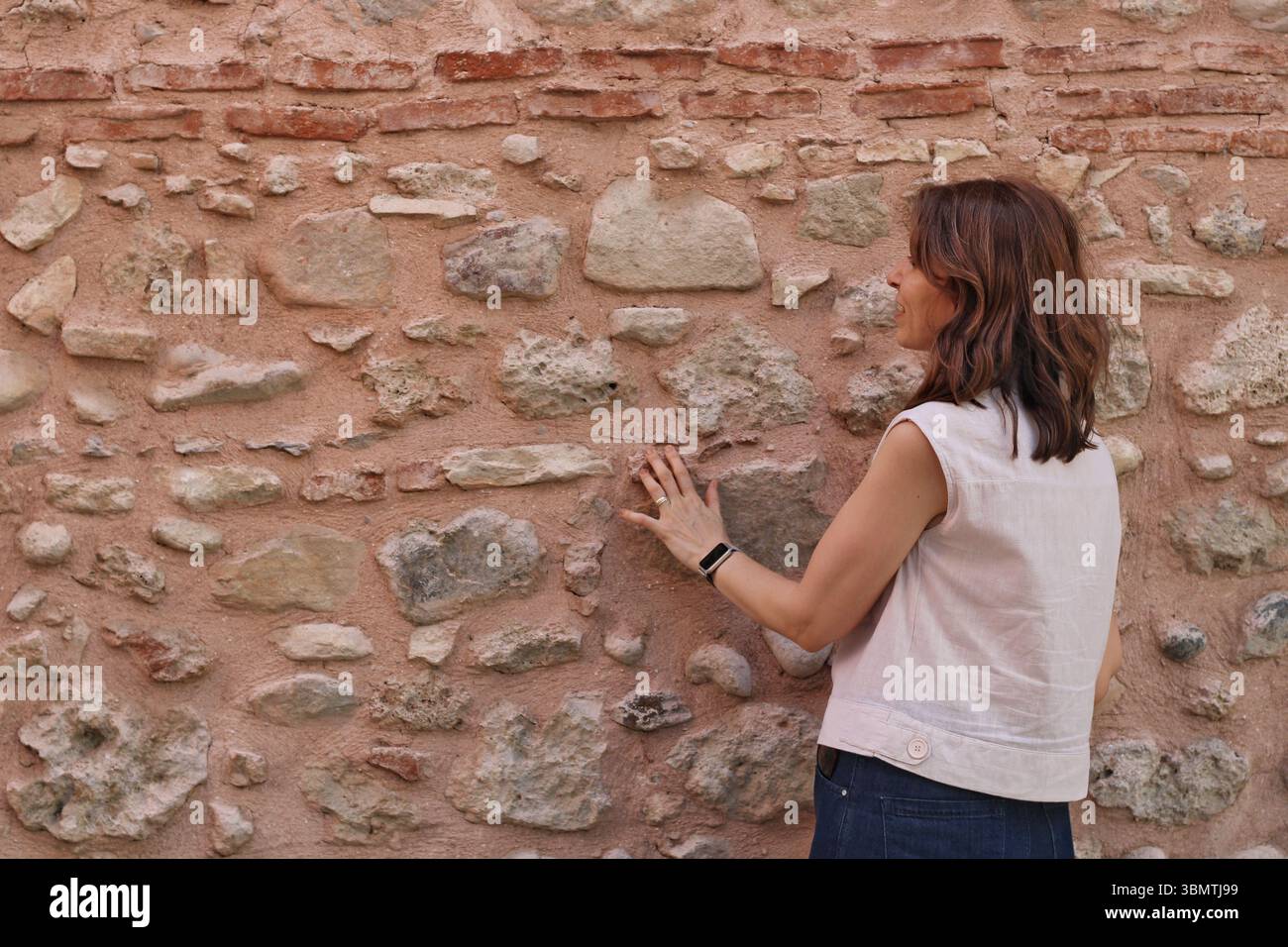 Woman touching wall surface hi-res stock photography and images - Alamy