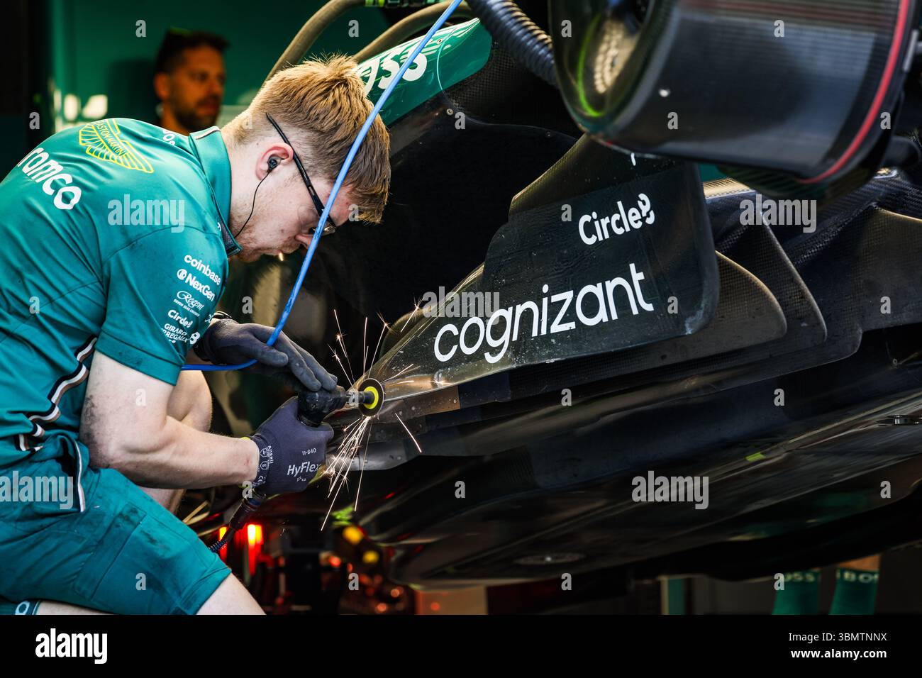 Aston Martin F1 Team AMR25, mechanical detail of mechanic working on ...