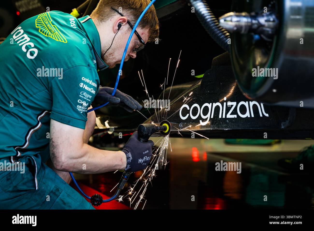 Aston Martin F1 Team AMR25, mechanical detail of mechanic working on ...