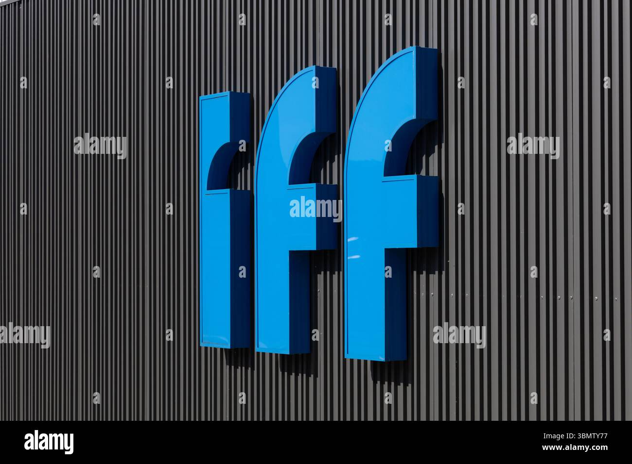 The bold blue "IFF" logo stands out prominently against a modern ...