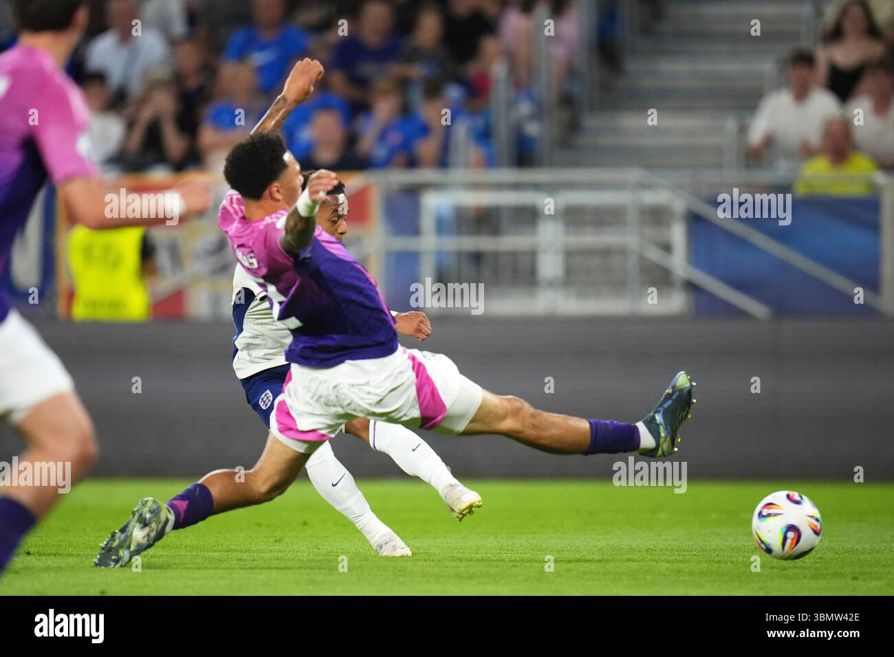 England's Omari Hutchinson, in the background, scores his side's second ...