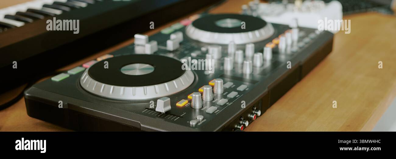 Electronic Dj Controller and Keyboard on Table for Gen Z Music ...