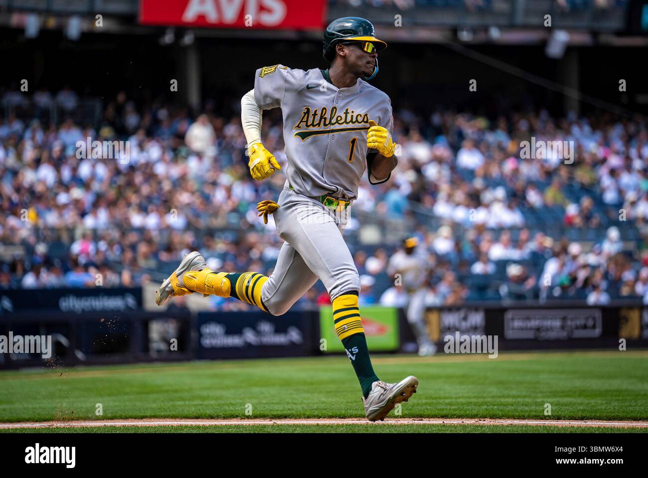 Athletics' Denzel Clarke (1) runs up the baseline as he flies out to ...