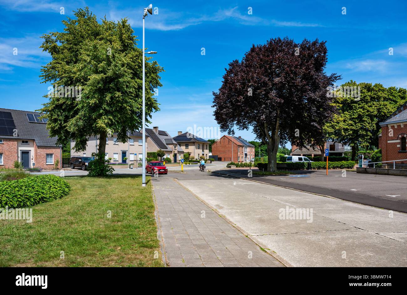 Residential street and detached houses in the village of Beringen ...
