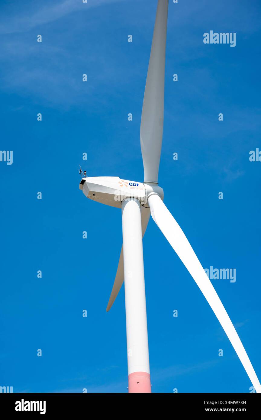 EDF Luminus windmill for electricity production against blue sky in ...