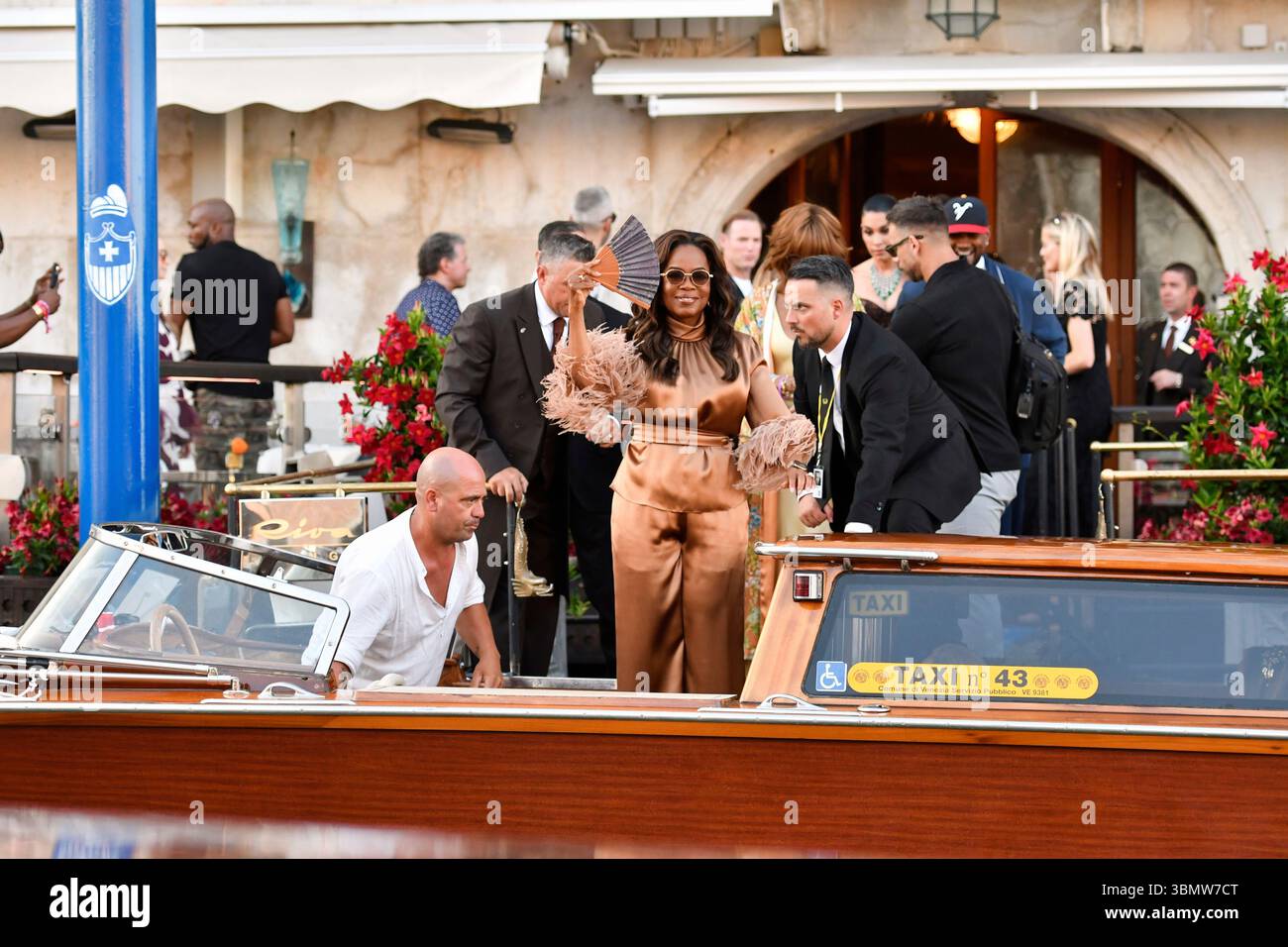 Oprah Winfrey leaves a hotel during celebrations for Jeff Bezos and ...