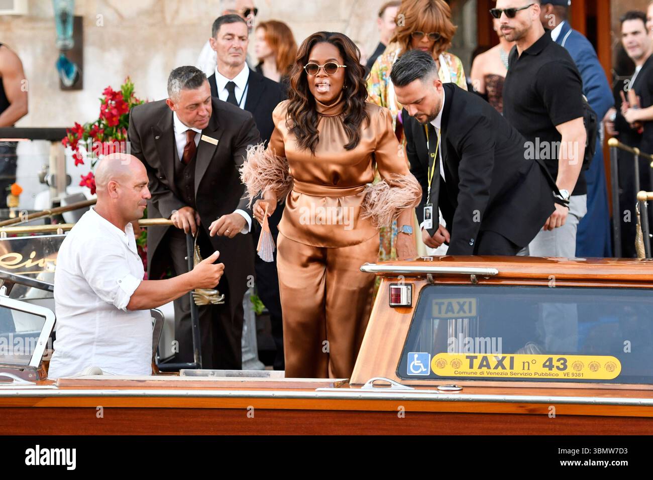Oprah Winfrey leaves a hotel during celebrations for Jeff Bezos and ...