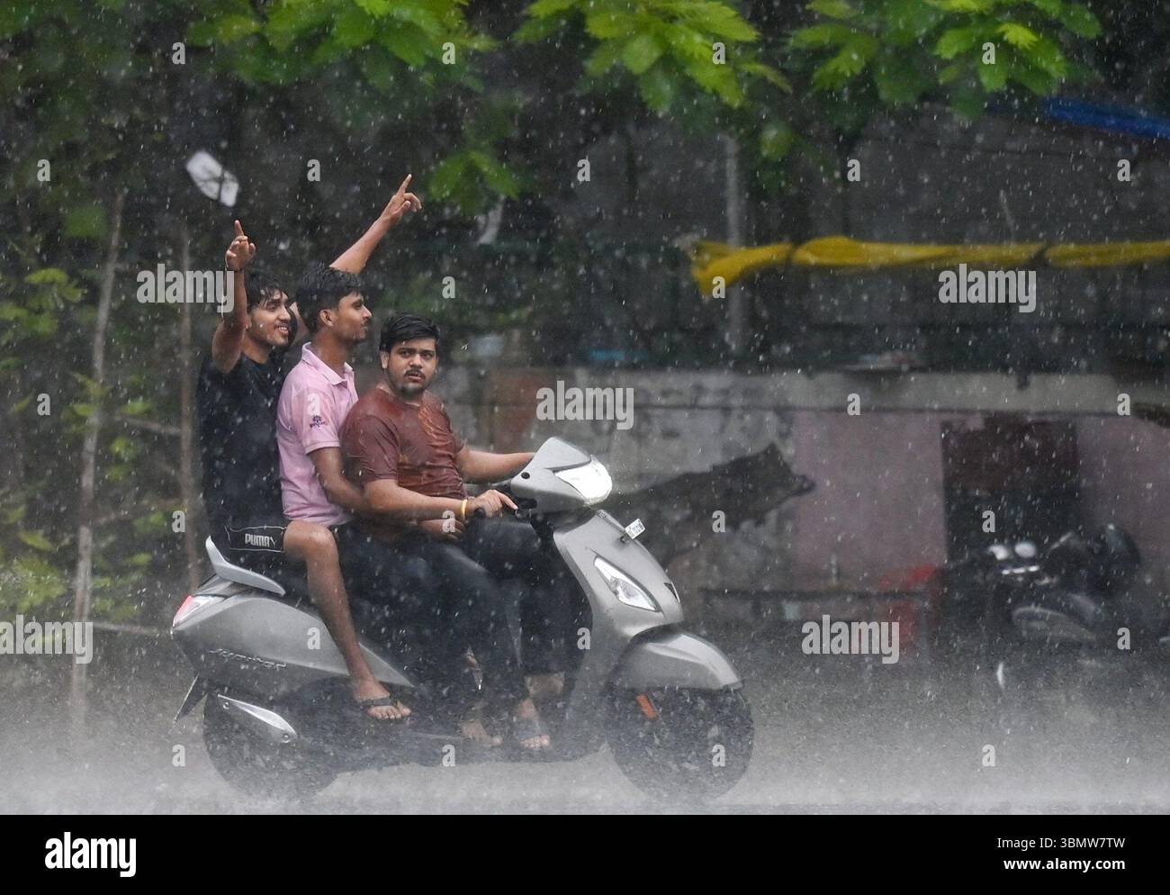 NOIDA, INDIA - JUNE 28: Commuters seen during rain in the evening. Rain ...
