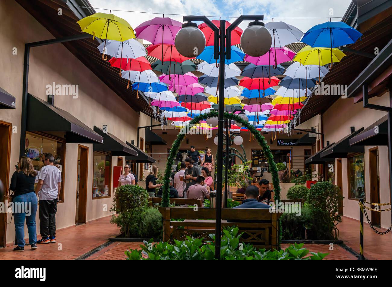 Colorful umbrella canopy decorates Inverness Mall courtyard at Monte ...