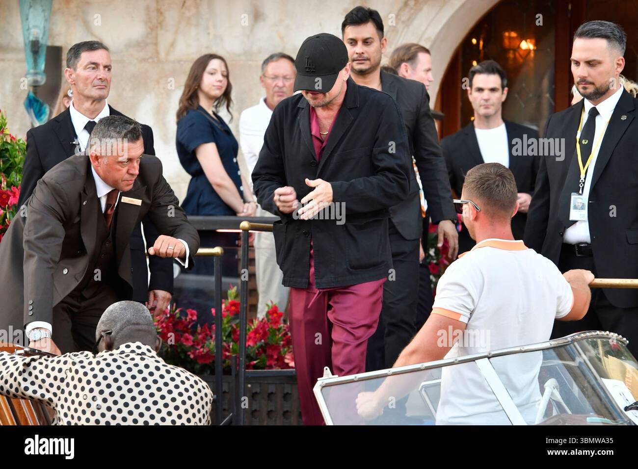 Leonardi Di Caprio and leaves a hotel during celebrations for Jeff ...