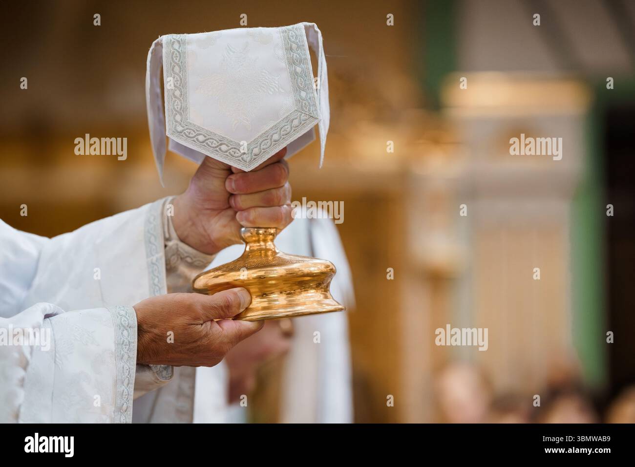Catholic Priest Holding the Holy Eucharist Chalice During Religious Ceremony in Church Gold ...