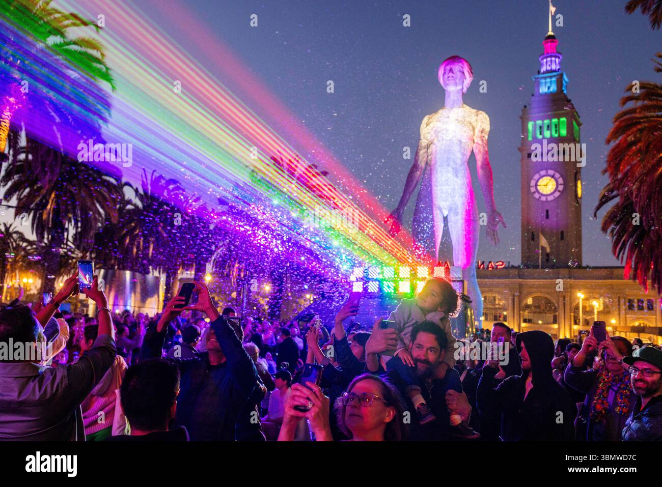 Rainbow lasers create a pride flag projected on Market Street from the ...